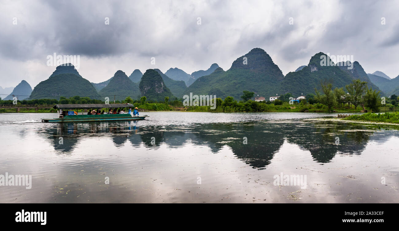 Guilin, China, 19 Jun 2014: Tourist boat sailing at Li River with ...