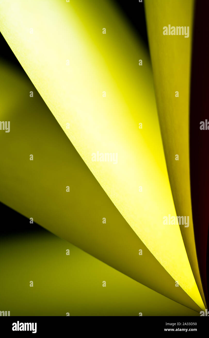 bright yellow colored illuminated notepad in various position and ...