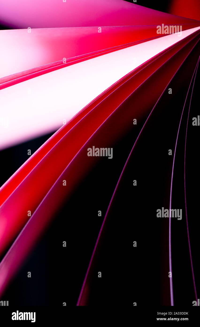 bright pink colored illuminated notepad in various position and ...