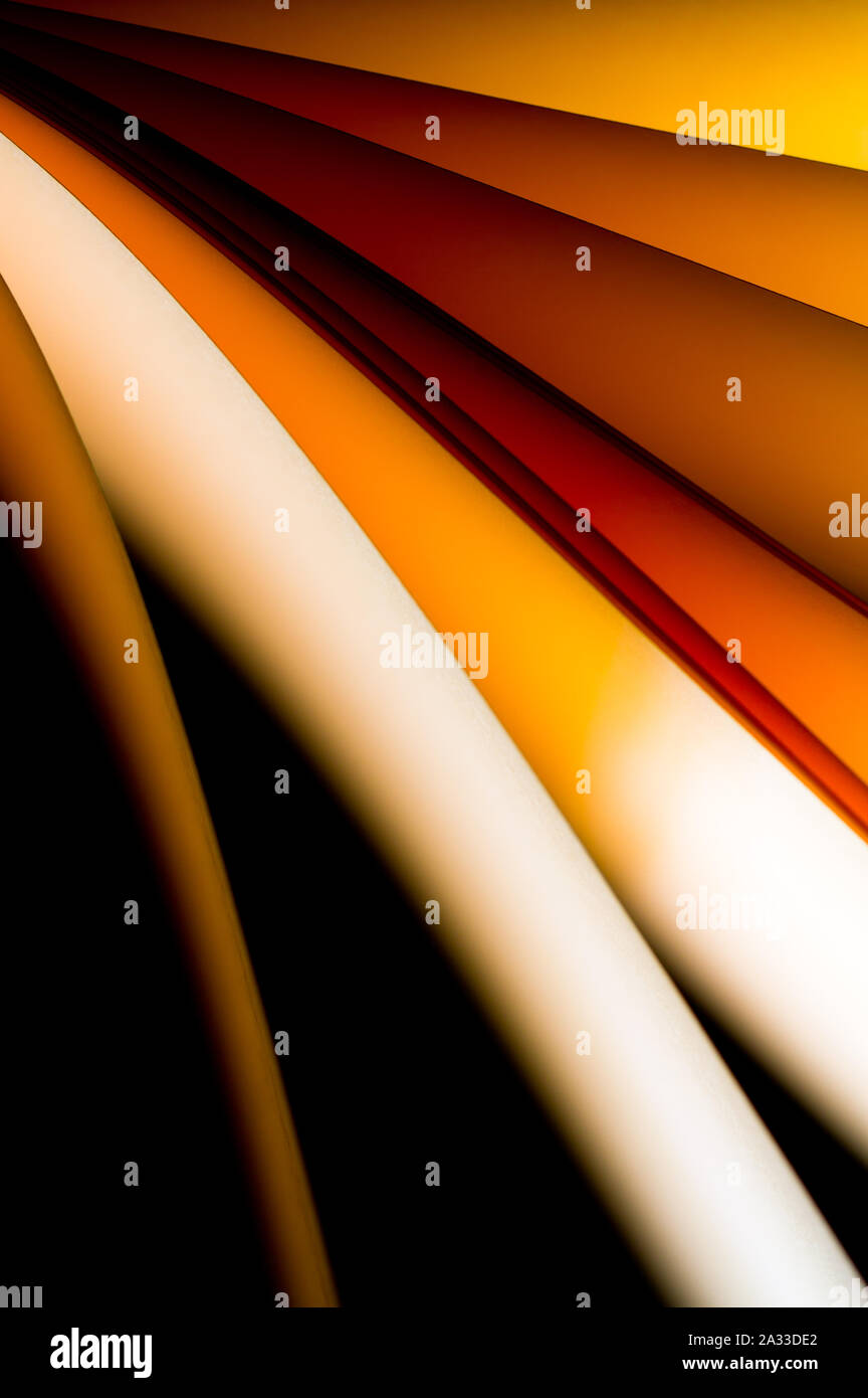 bright orange colored illuminated notepad in various position and ...