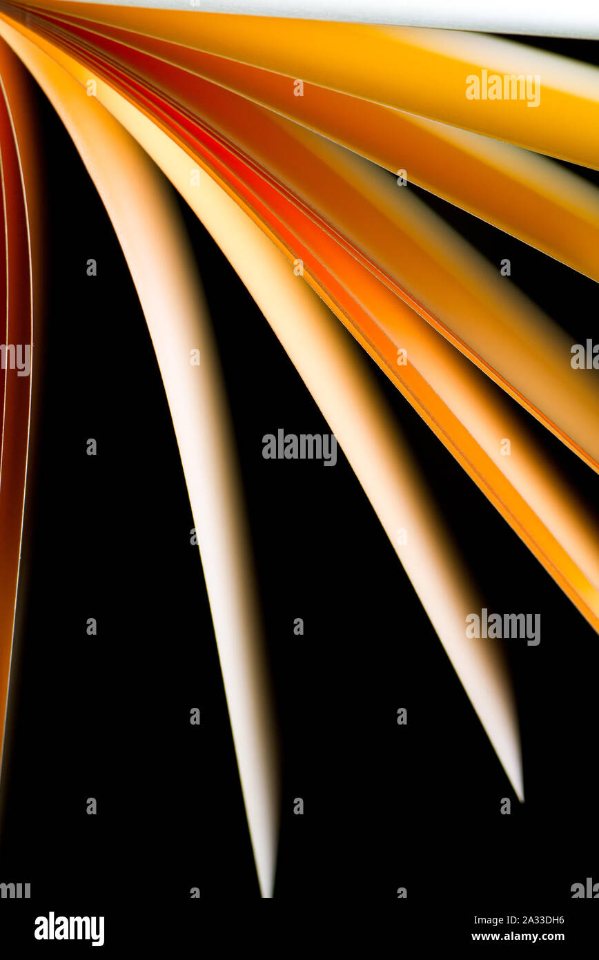 bright orange colored illuminated notepad in various position and ...