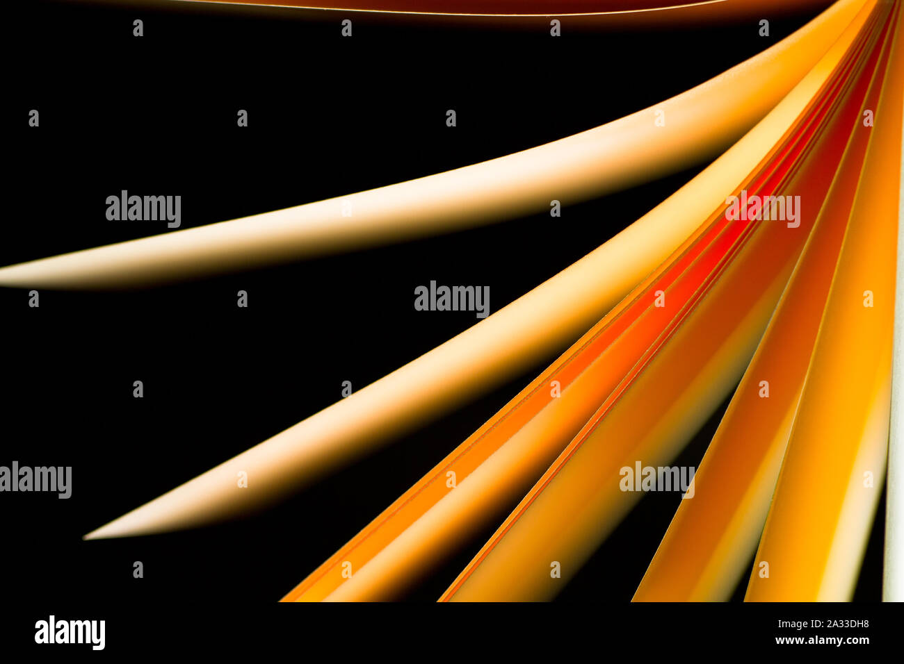 bright orange colored illuminated notepad in various position and ...
