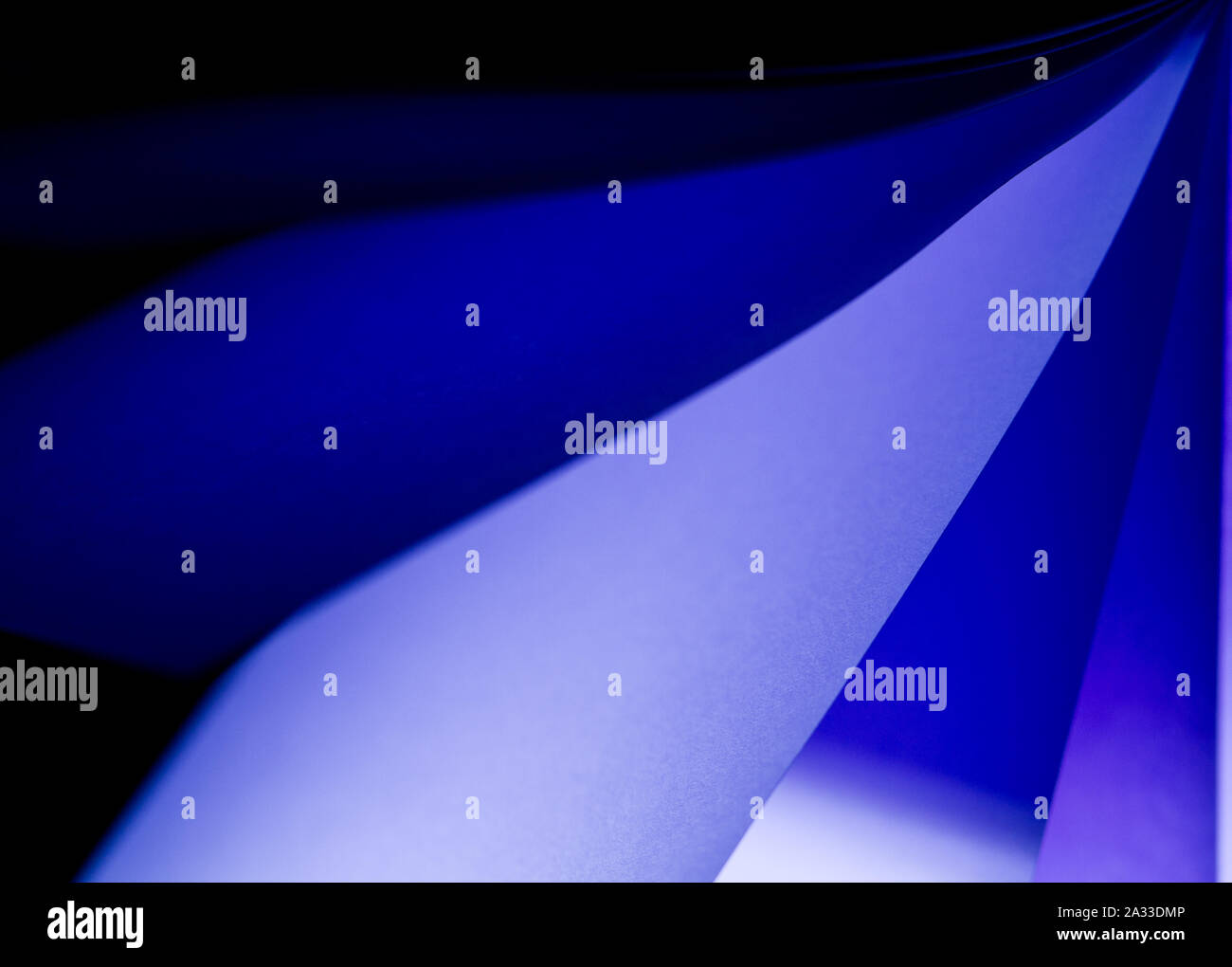 bright blue colored illuminated notepad in various position and ...