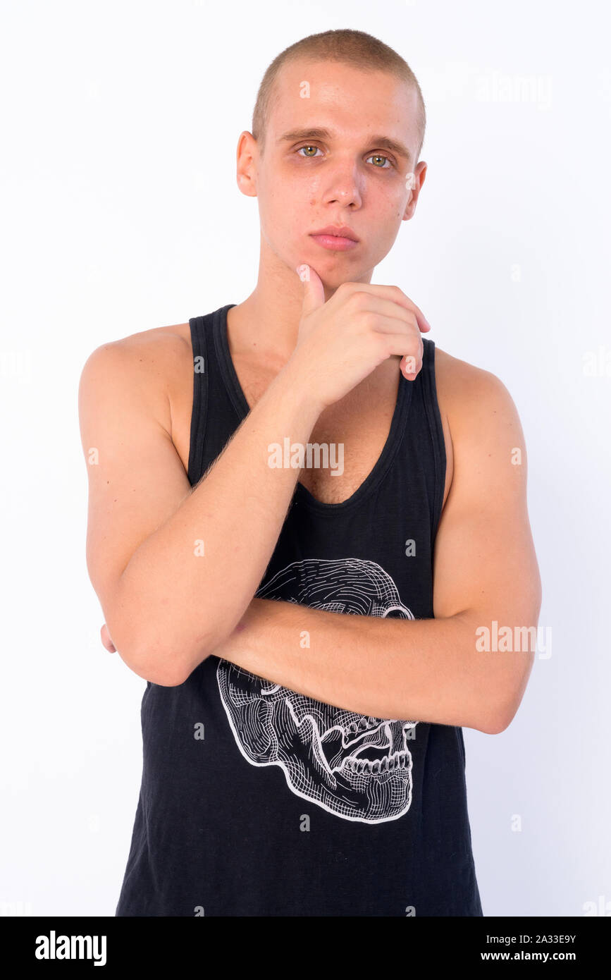 Portrait of young bald rebellious man thinking Stock Photo - Alamy