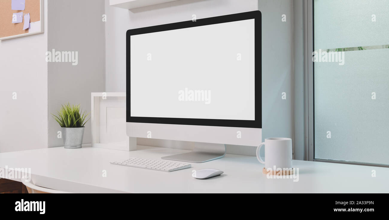 Blank screen desktop computer with office supplies in minimal modern ...