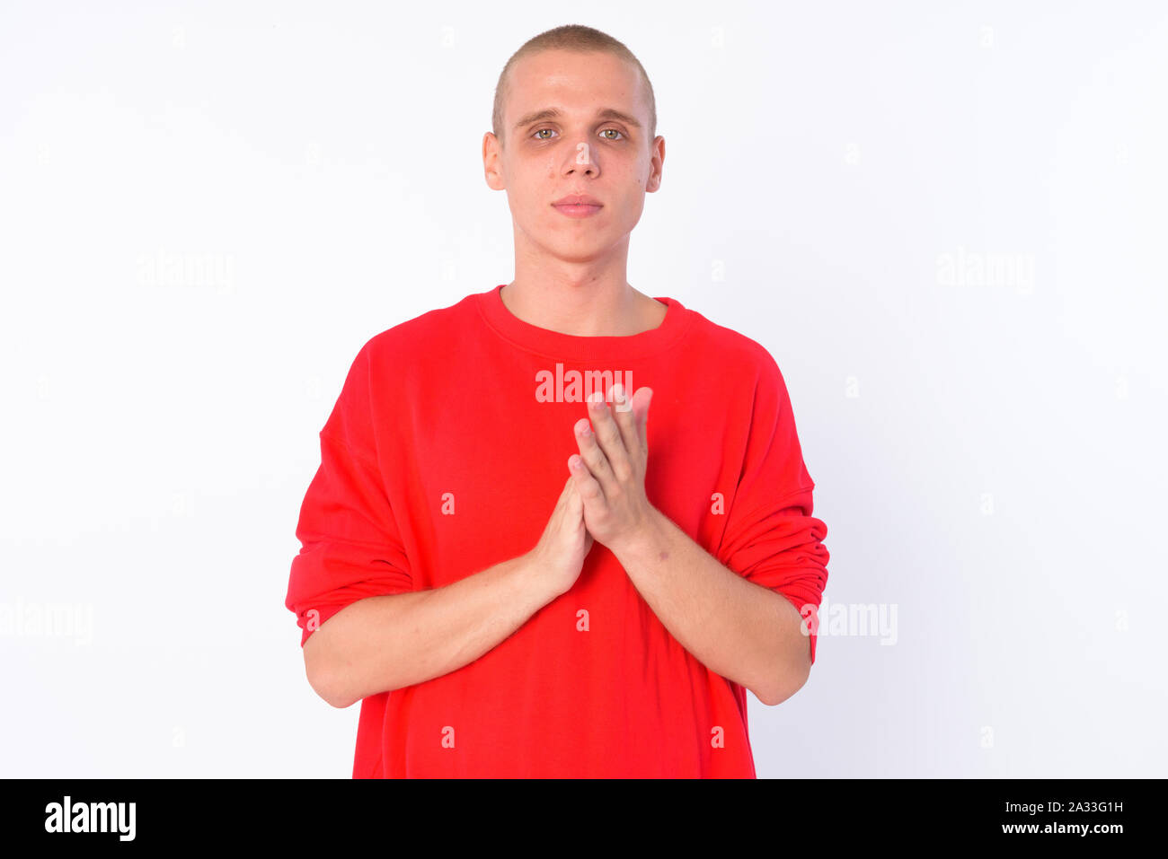 Portrait of young bald man clapping hands Stock Photo - Alamy