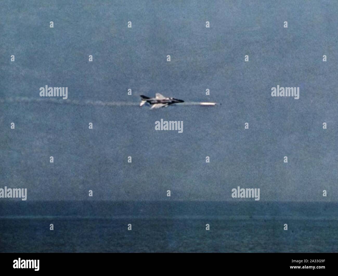 F-4J Phantom II of VF-114 launches Sidewinder missile c1974 Stock Photo ...
