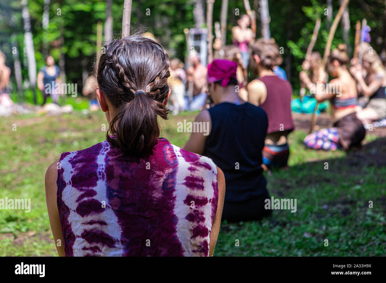 A group of open minded individuals wearing colorful clothes are seen ...