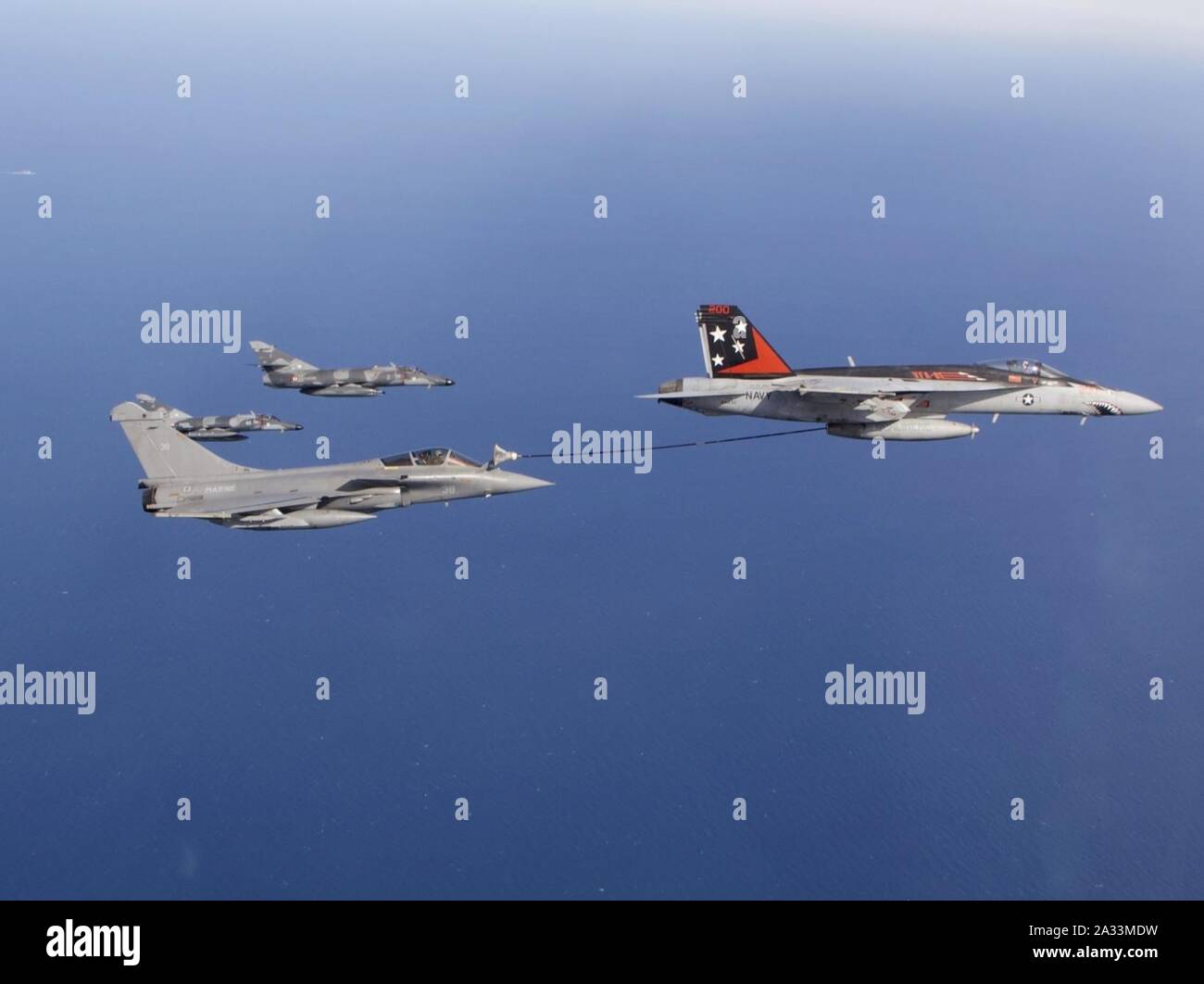 FA-18E of VFA-81 refuels Rafale of Flottille 11F in March 2015 Stock ...