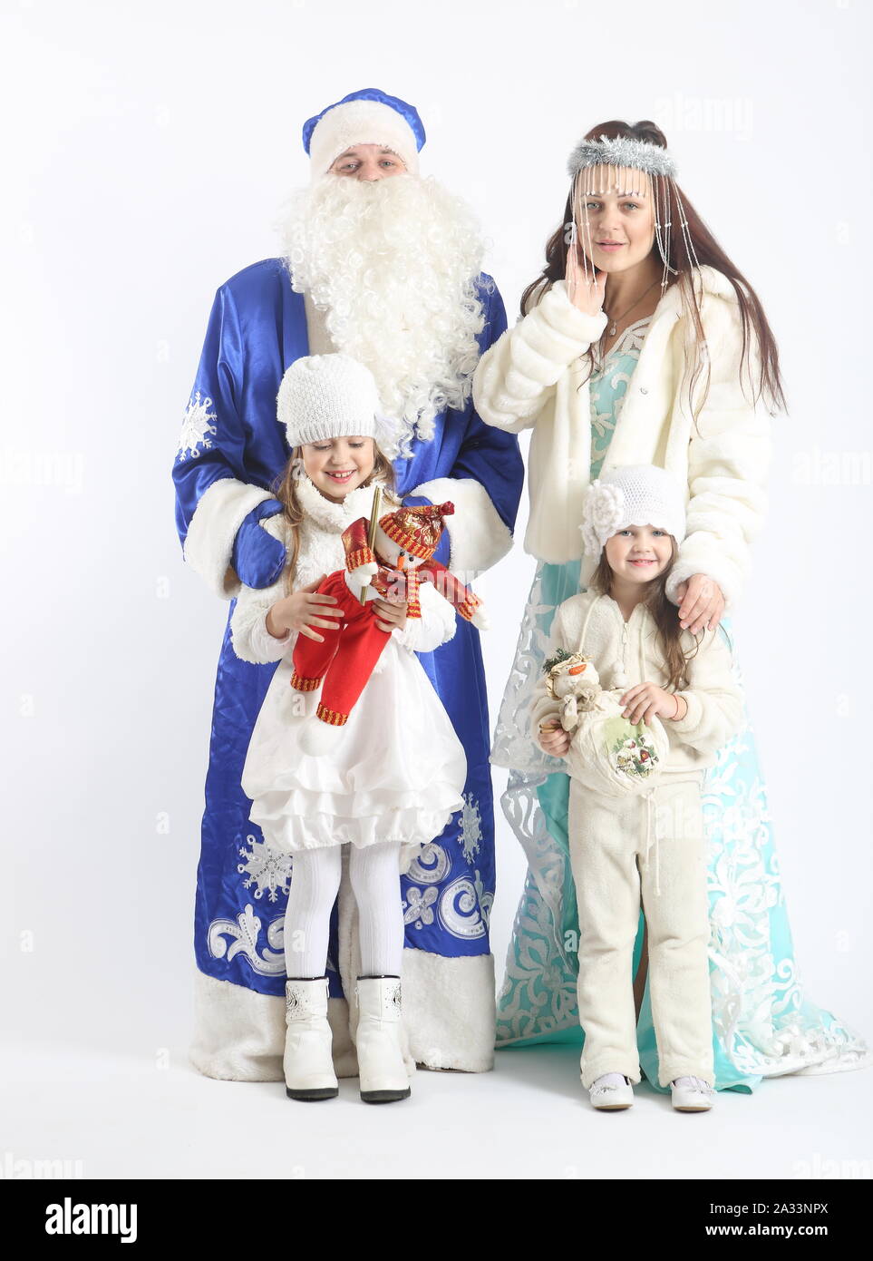 Santa Claus and Snow Maiden in blue costumes with children and gifts ...
