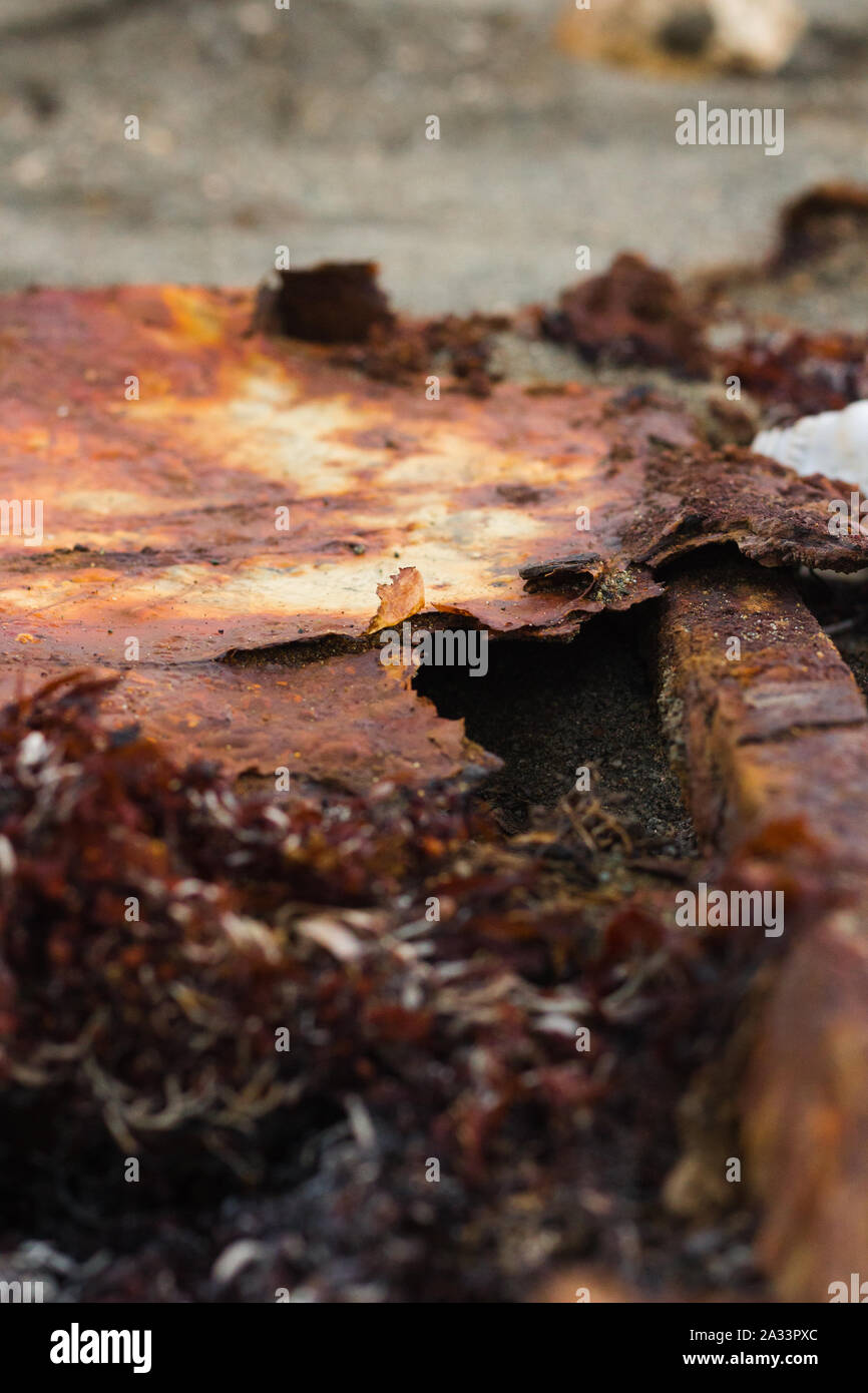 Rusted sign on the beach Stock Photo - Alamy
