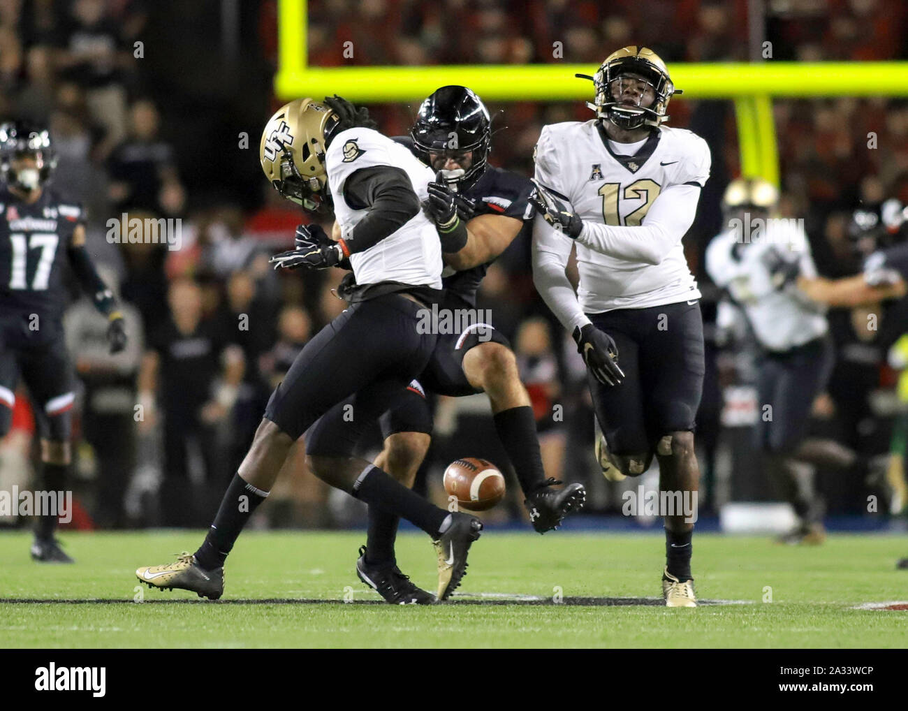 Cincinnati, Ohio, USA. 4th Oct, 2019. UCF's Antwan Collier (left) puts ...
