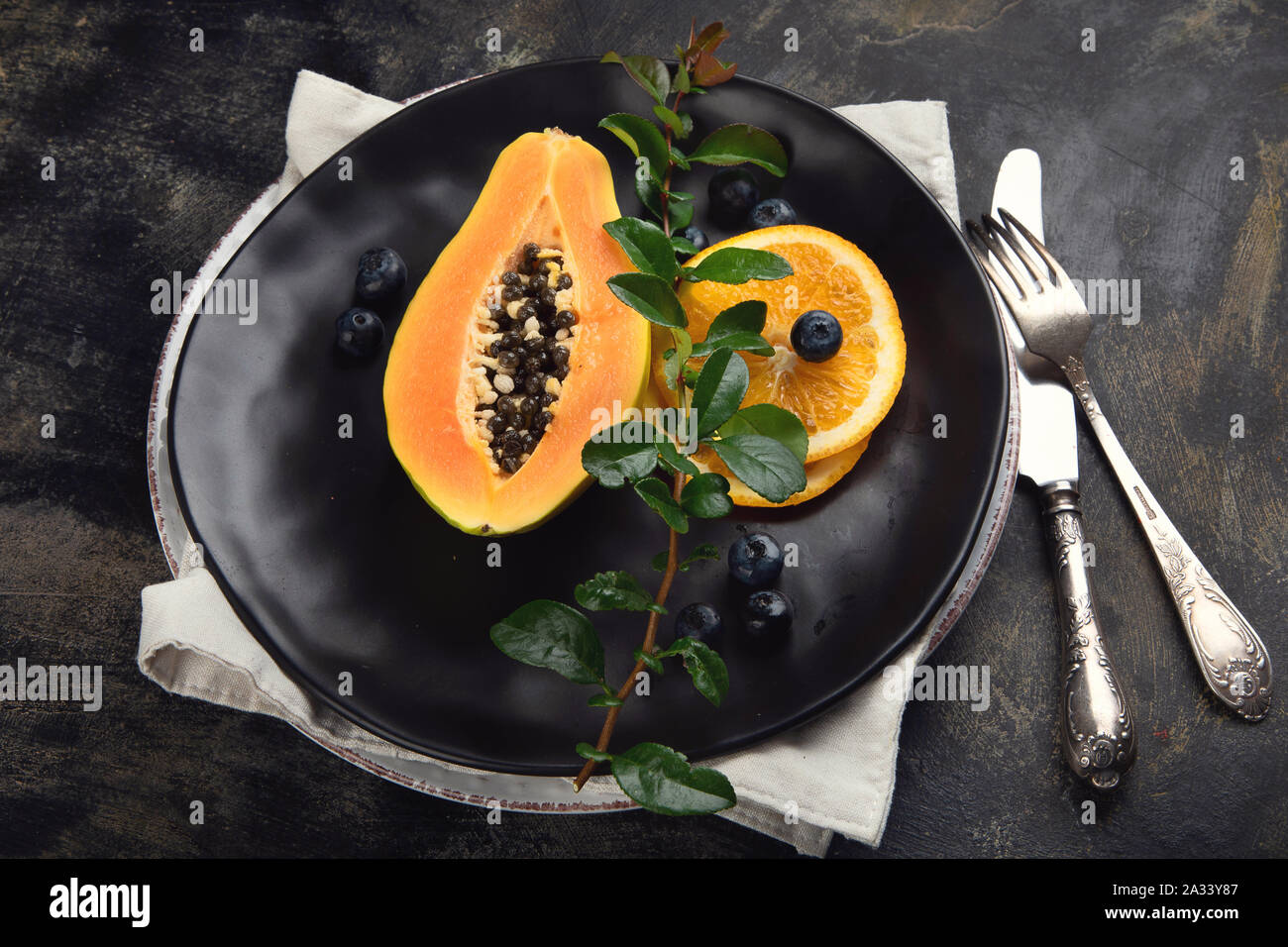 Holiday table setting on black background Stock Photo - Alamy