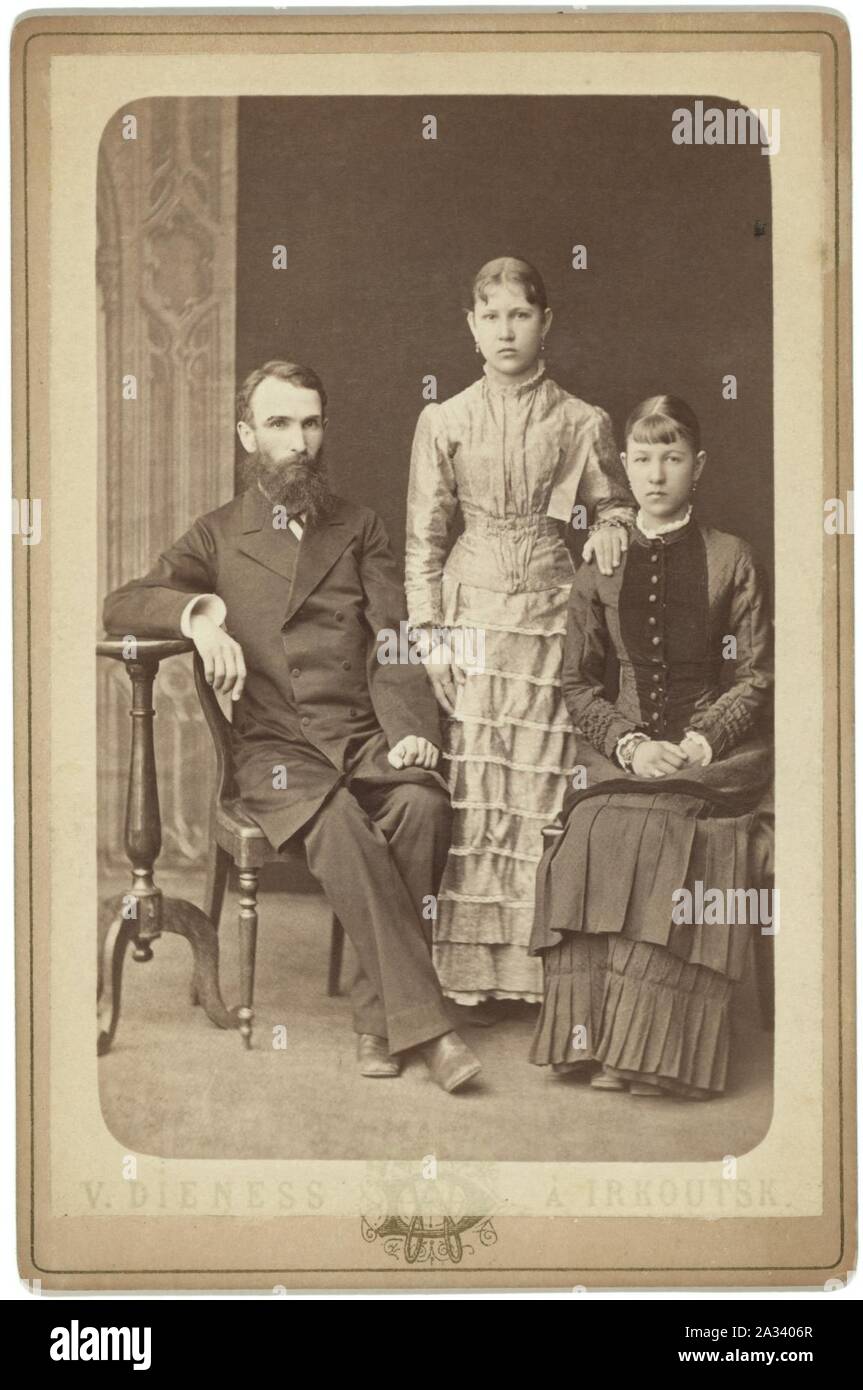Family portrait of an unidentified man and his two daughters Stock ...