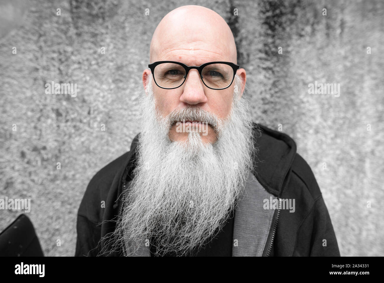 Mature bald man with long gray beard wearing eyeglasses outdoors Stock ...