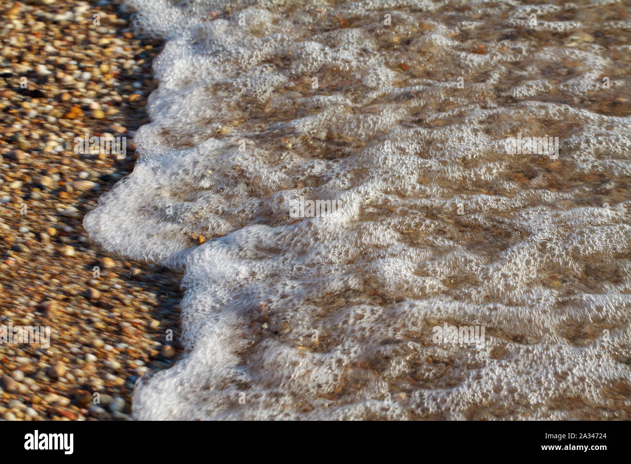 sea pebbles colored granite on the beach background stones. The shore ...