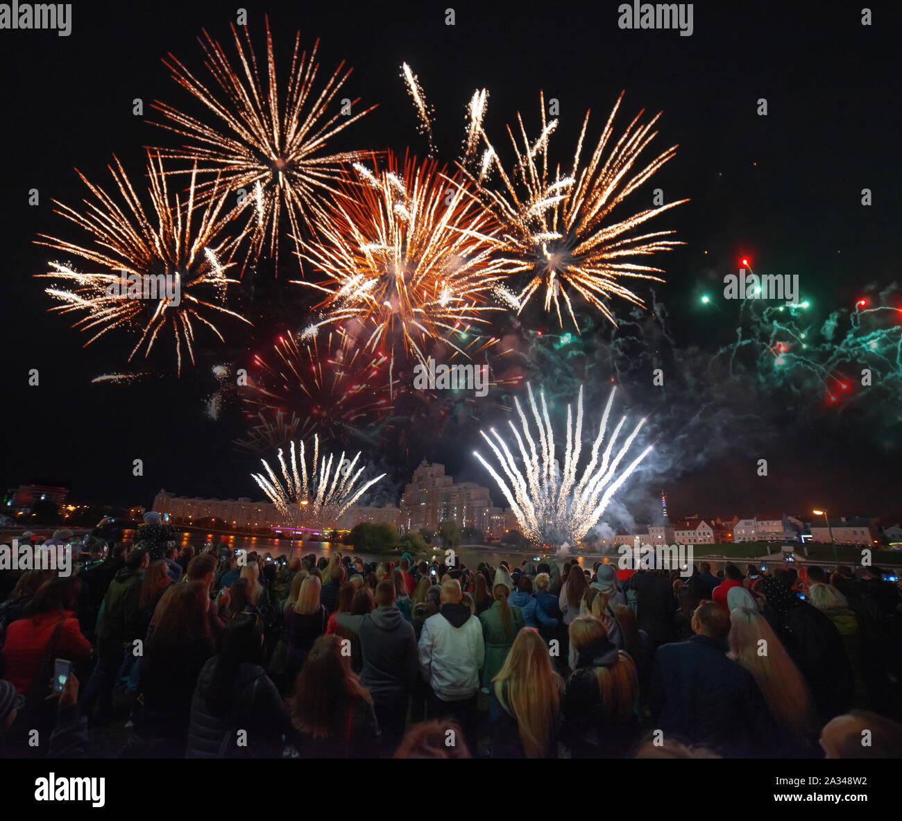fireworks in the city. A lot of people look at the lights Stock Photo ...