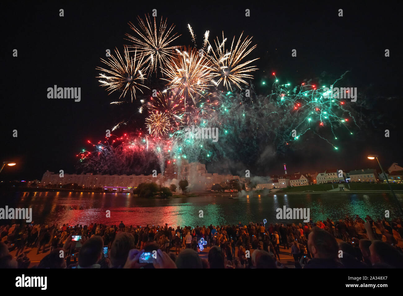 fireworks in the city. A lot of people look at the lights Stock Photo ...