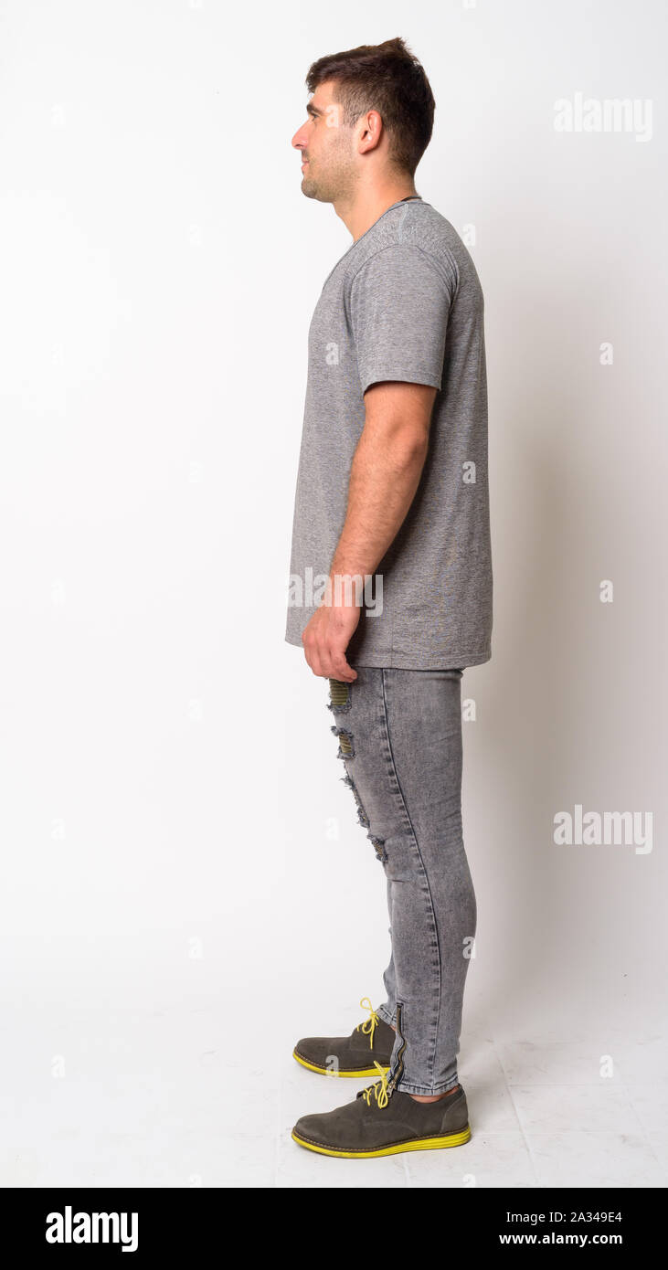 Full body shot profile view of young Persian man Stock Photo - Alamy