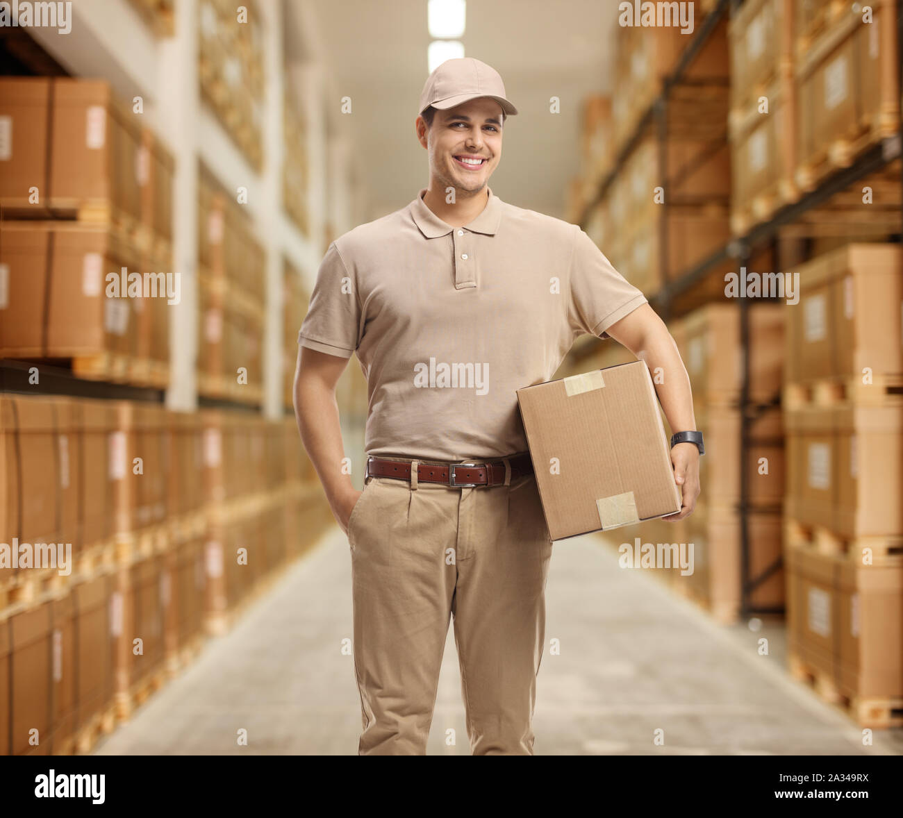 Warehouse man holding box hi-res stock photography and images - Alamy