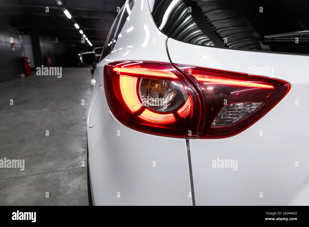 Back view of new white city crossover. Closeup headlights of car SUV ...