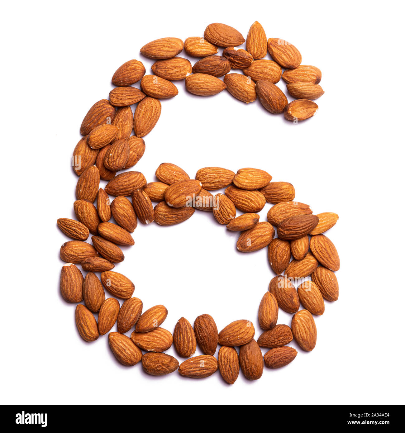 Arabic numeral "6" from a peeled almond on a white isolated background ...