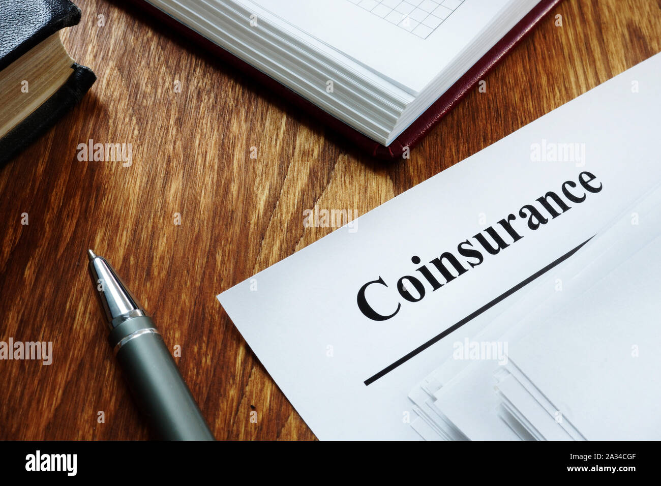 Coinsurance concept. Stack of insurance documents on desk Stock Photo ...