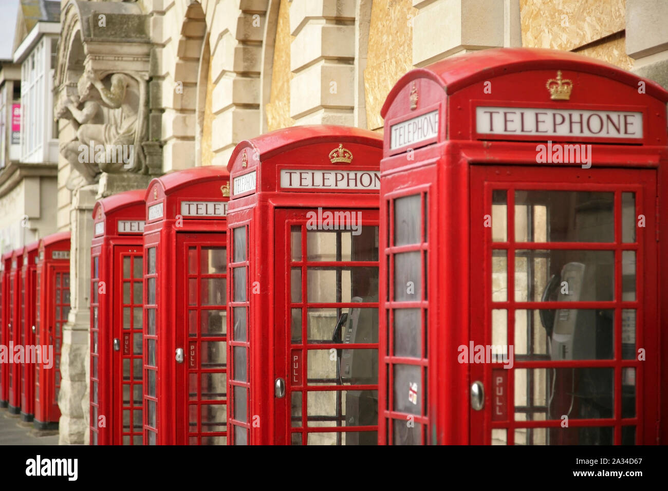 Row of traditional red telephone boxes outside the main Post Office ...