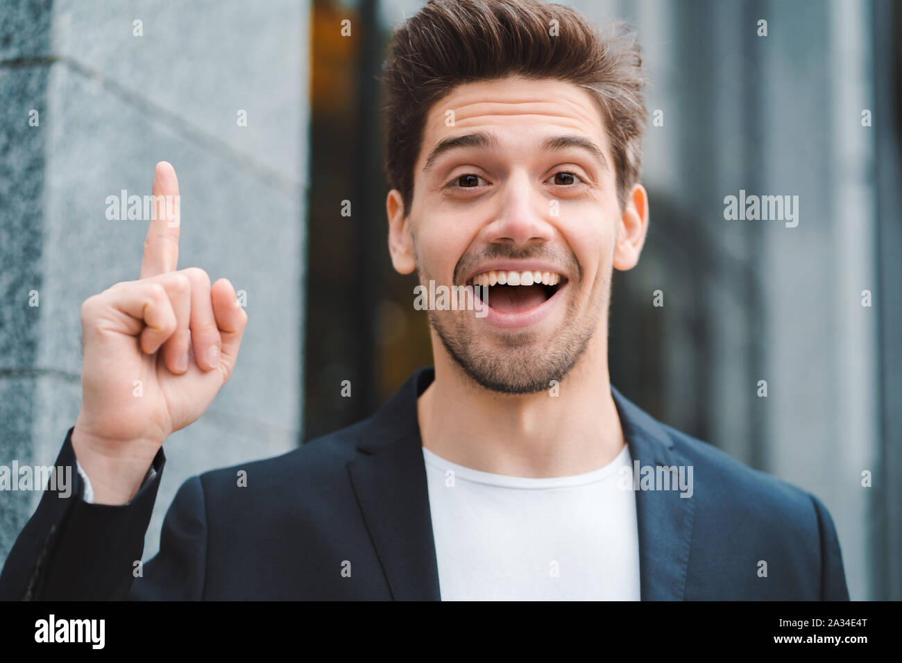 Businessman pointing modern building hi-res stock photography and ...