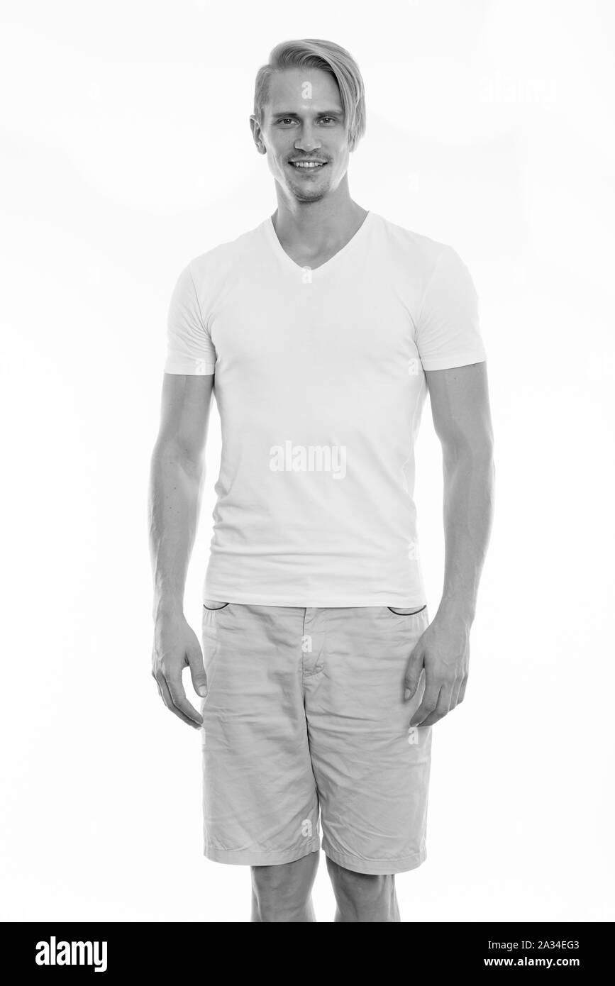 Handsome man smiling standing Black and White Stock Photos & Images - Alamy