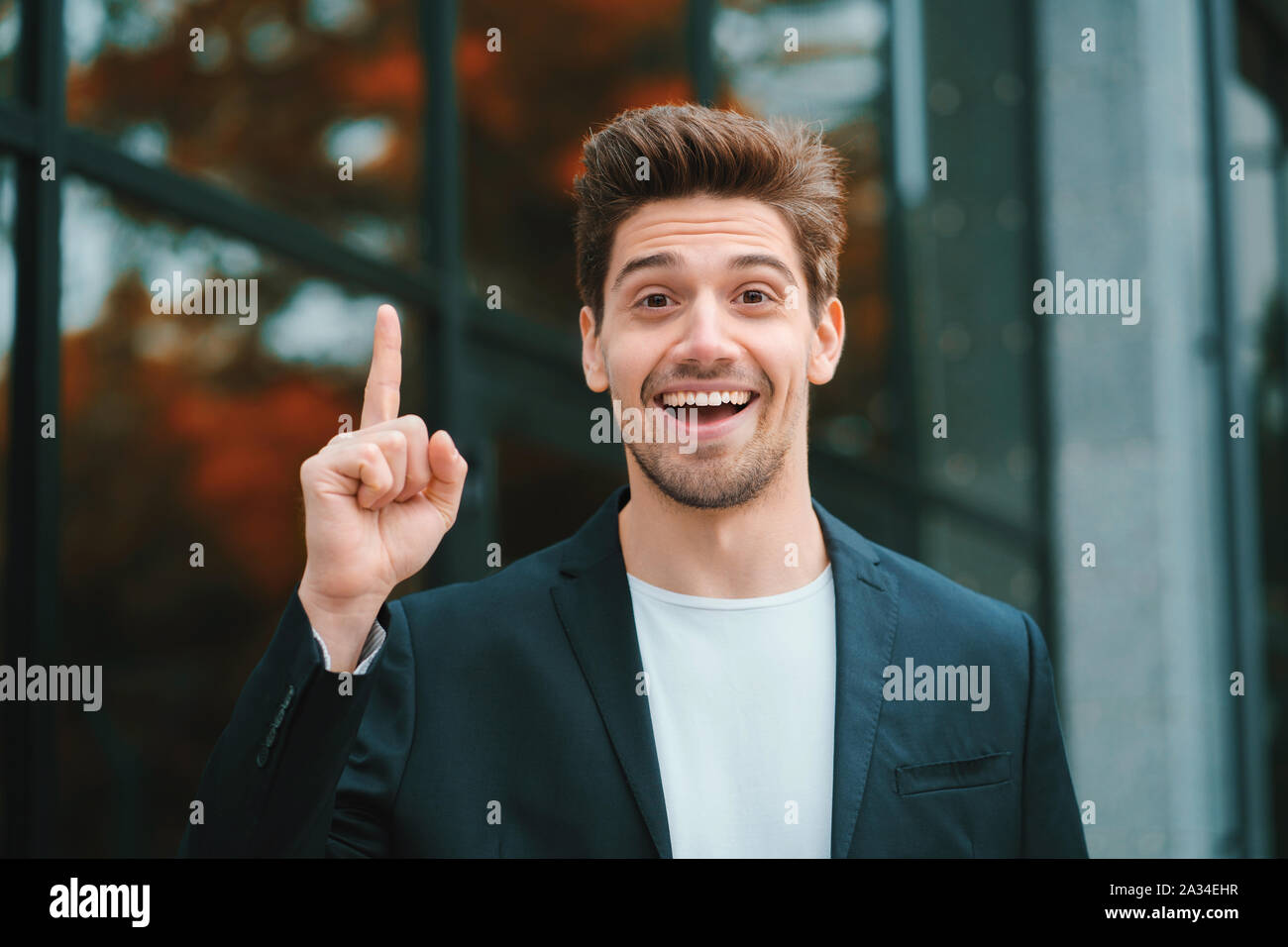 Businessman pointing modern building hi-res stock photography and ...