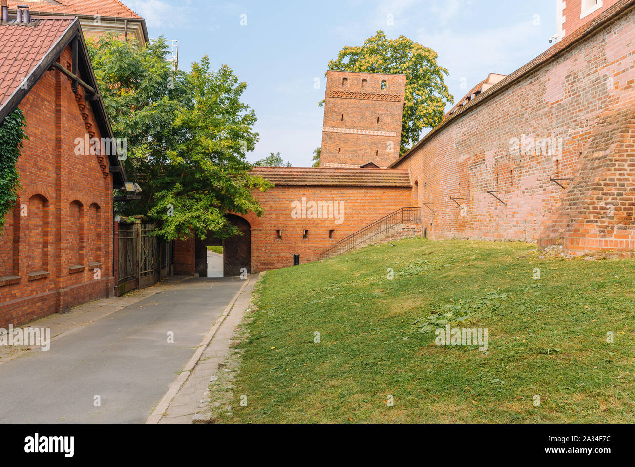 The leaning tower in Torun. Medieval city walls Stock Photo - Alamy
