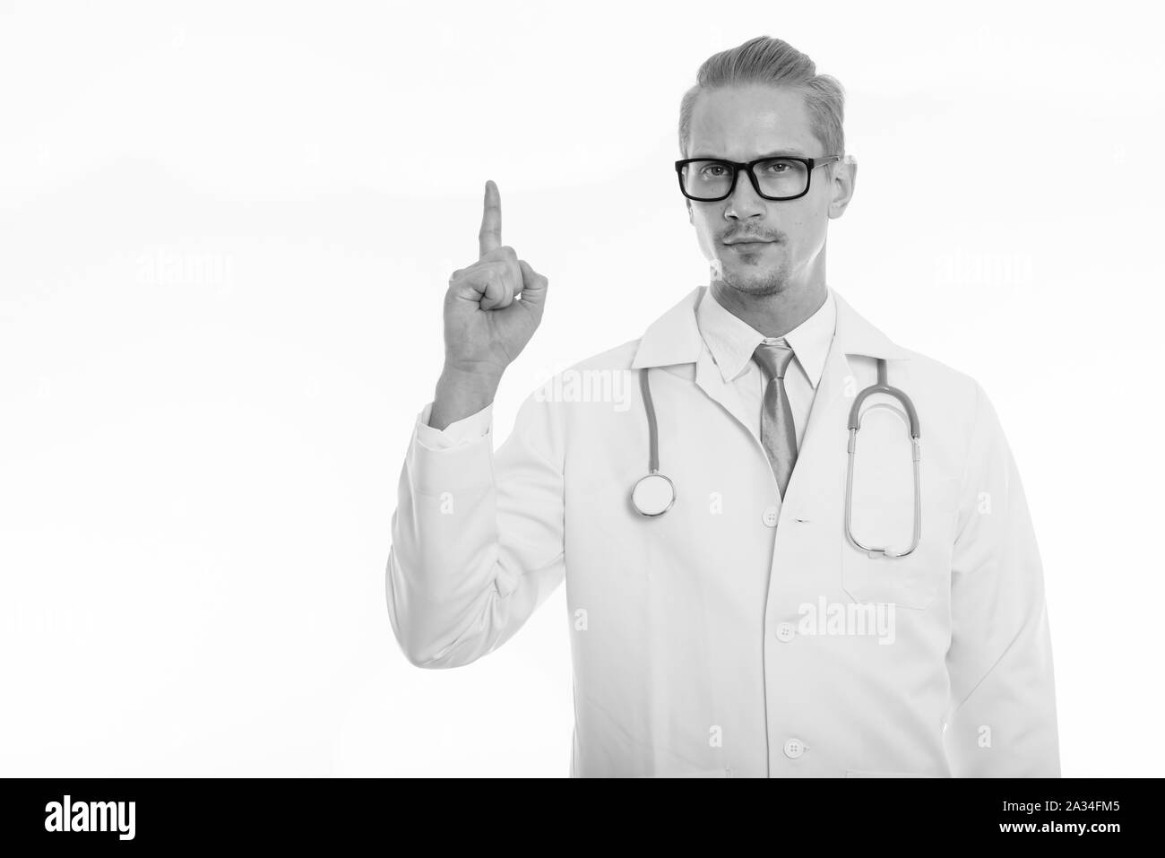 Doctor pointing at Black and White Stock Photos & Images - Alamy