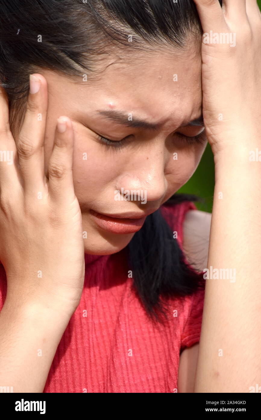A Young Filipina Female Under Stress Stock Photo - Alamy