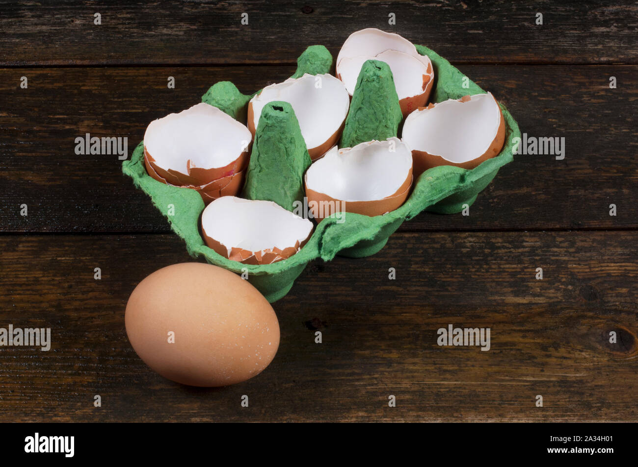 Studio shot of cracked, empty chicken egg shells in an egg box on a ...