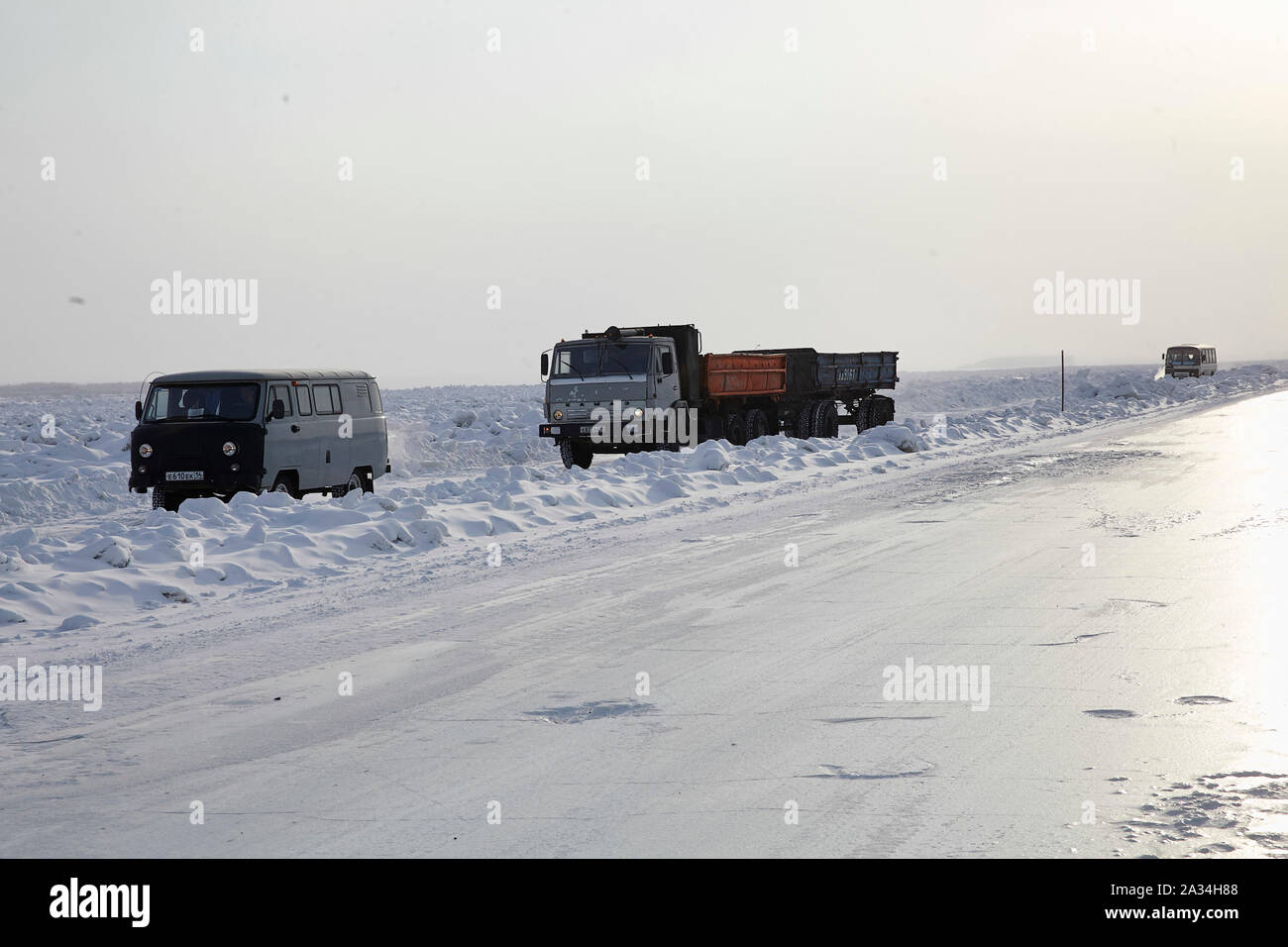 Russia Yakutsk trucks and cars using the river to come to the other ...