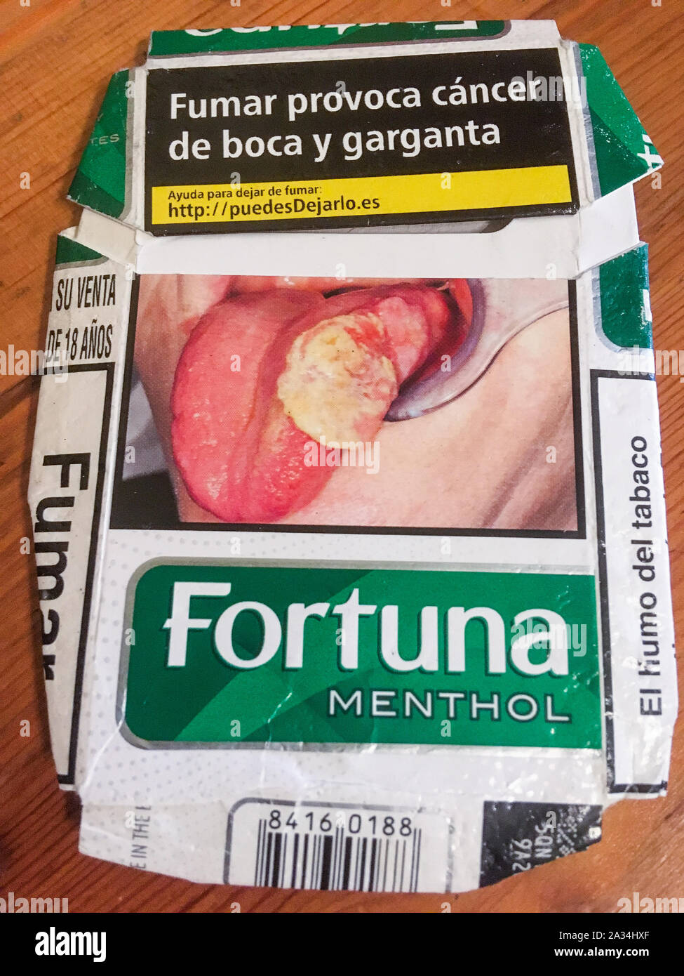 Healthcare warning written on a Spanish cigarettes pack Stock Photo - Alamy