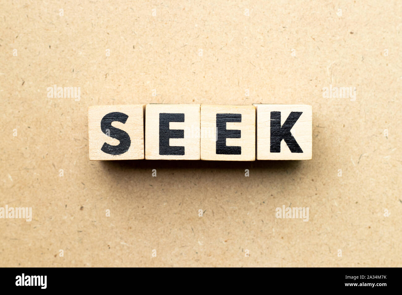 Letter block in word seek on wood background Stock Photo - Alamy