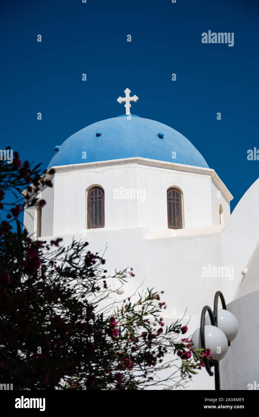 The blue domed building of Holy Cross Church in Perissa Stock Photo - Alamy