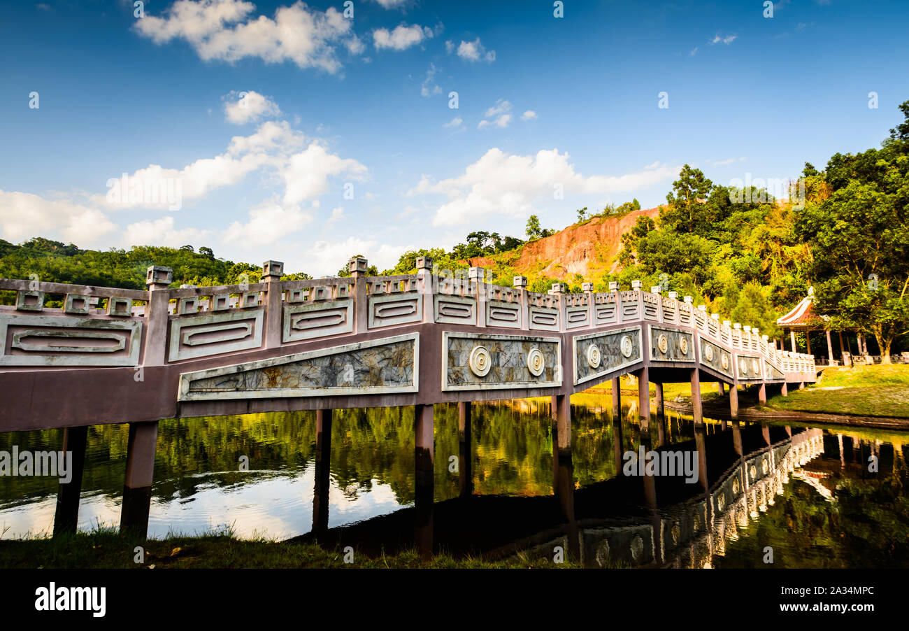 Chinese style bridge on the river under sunlight with blue sky Stock ...