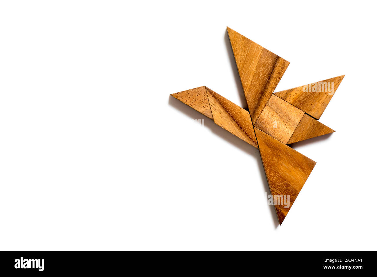 Wood tangram puzzle in flying bird on white background Stock Photo - Alamy