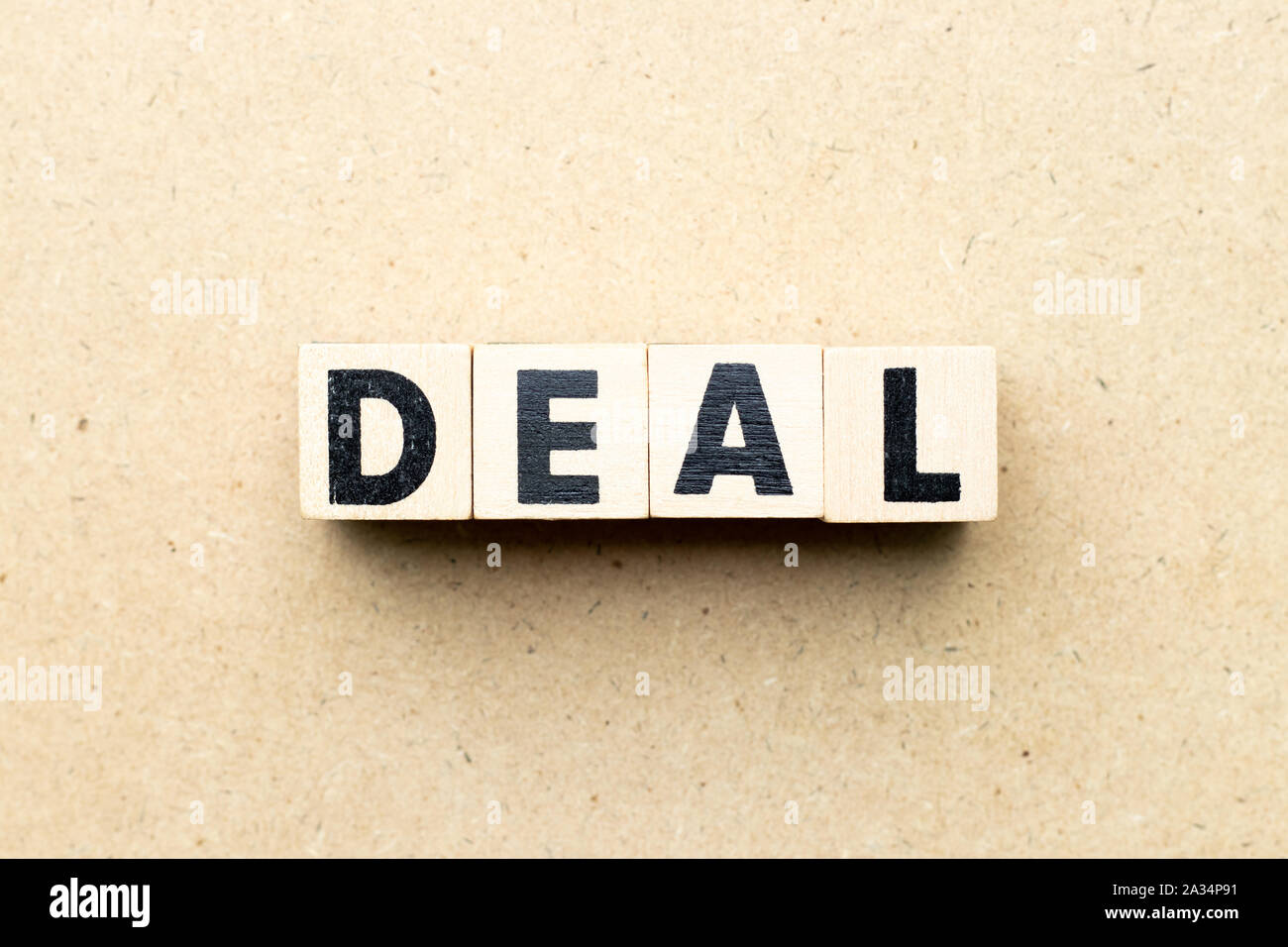 Alphabet letter block in word deal on wood background Stock Photo - Alamy