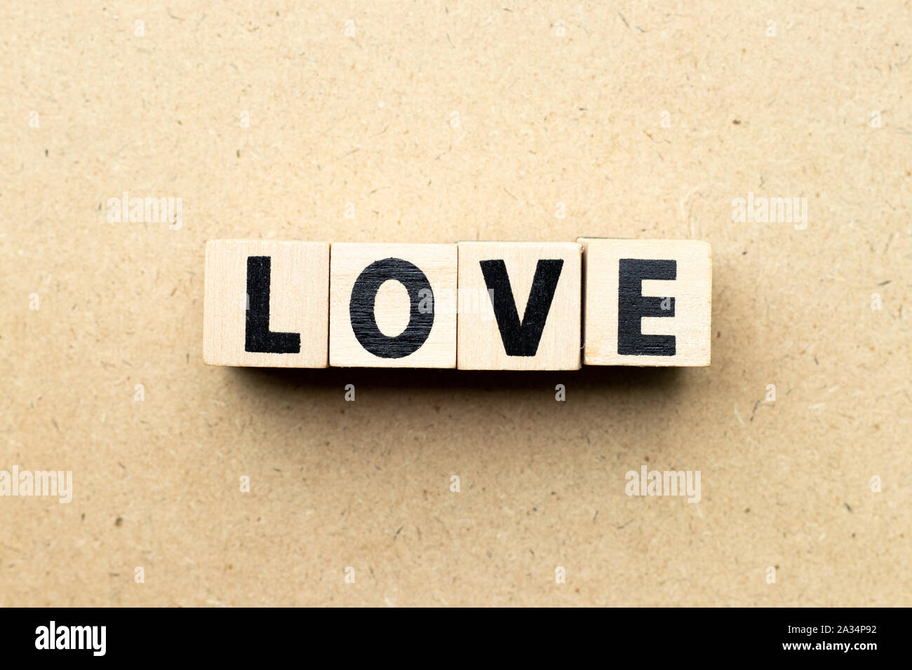 Letter block in word love on wood background Stock Photo - Alamy