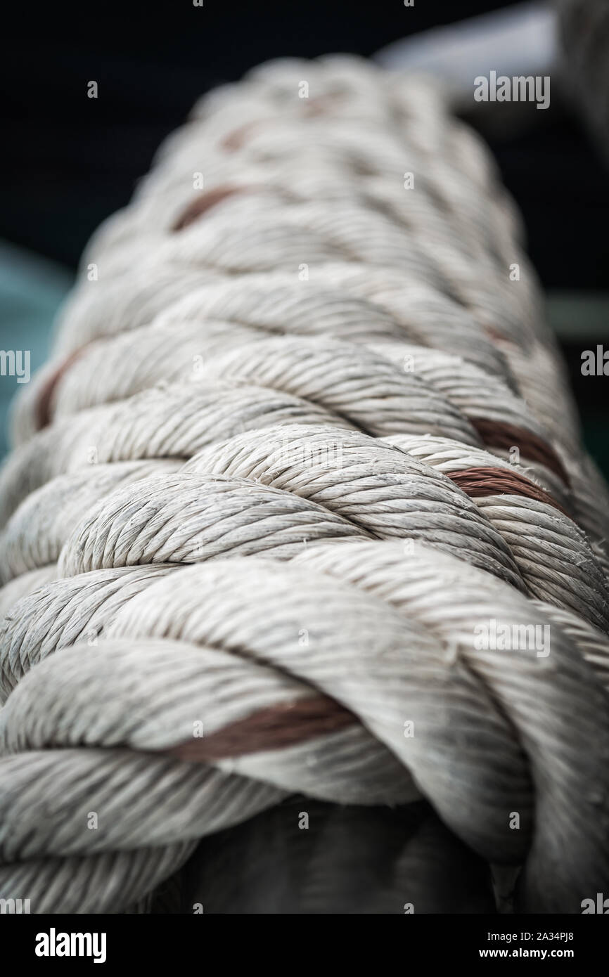 close up strands of a rope is tied with a pipe Stock Photo - Alamy