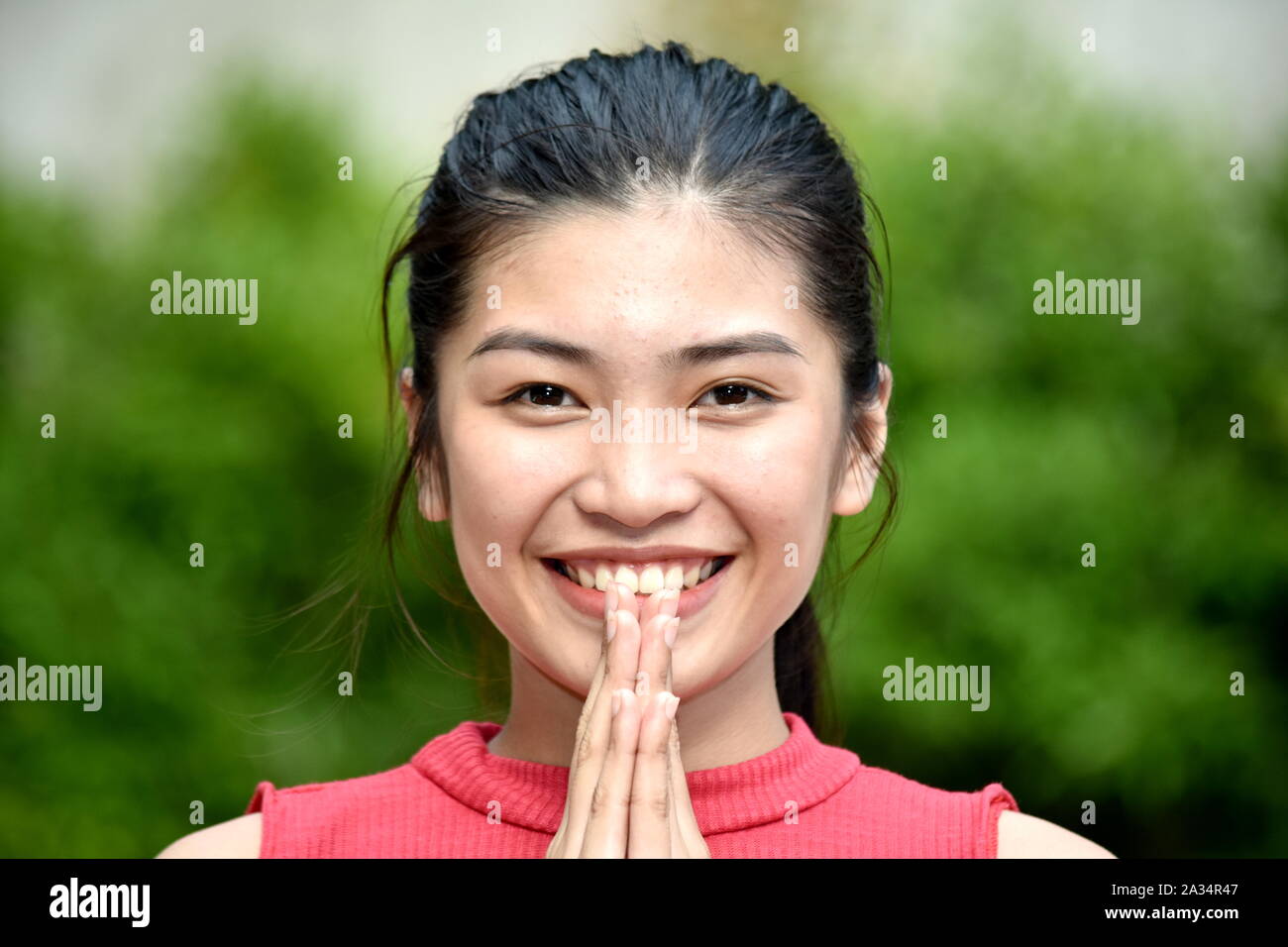 A Beautiful Diverse Female Youngster Praying Stock Photo - Alamy