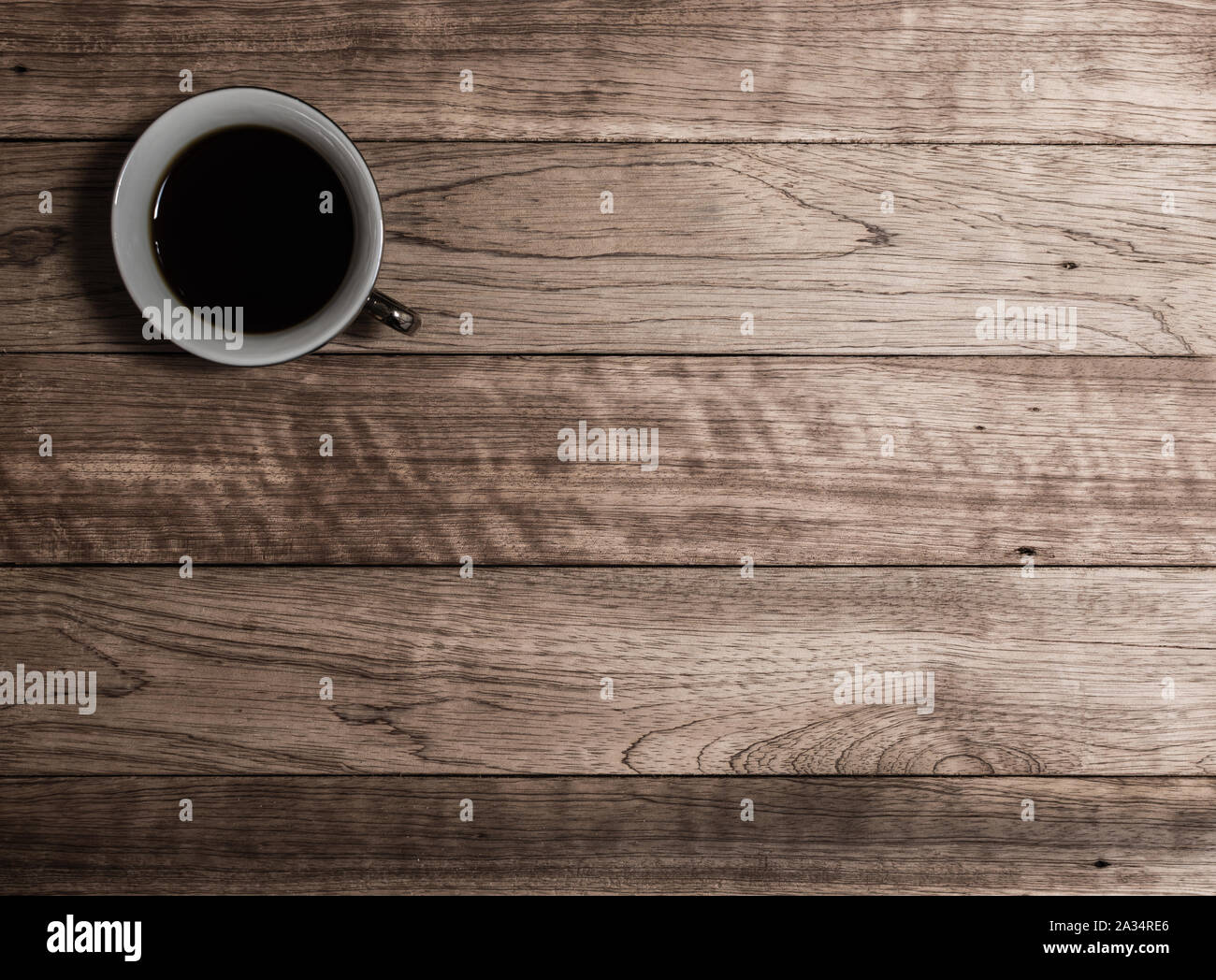 Cup of coffee on wooden plank table background Stock Photo - Alamy