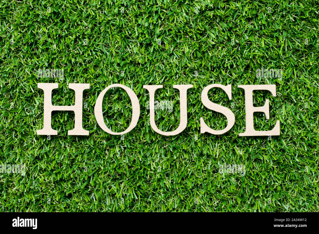 Wood alphabet letter in word house on green grass background Stock ...