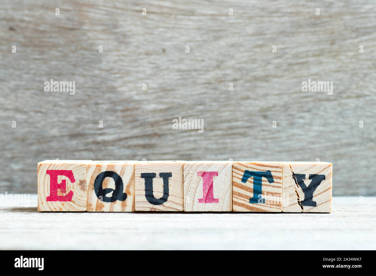 Letter block in word equity on wood background Stock Photo - Alamy