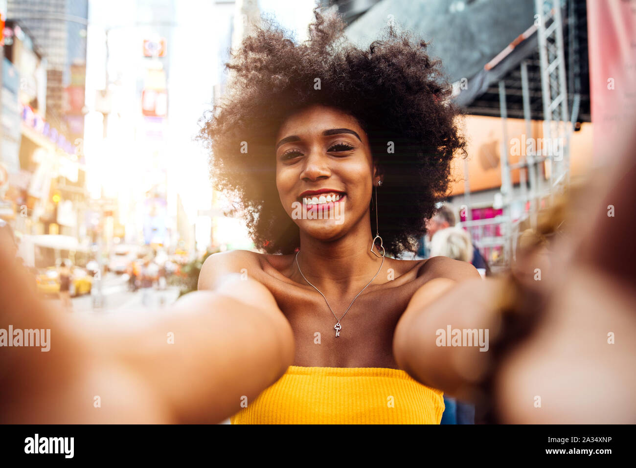 Young beautiful girl walking in Time square, manhattan. Lifestyle ...