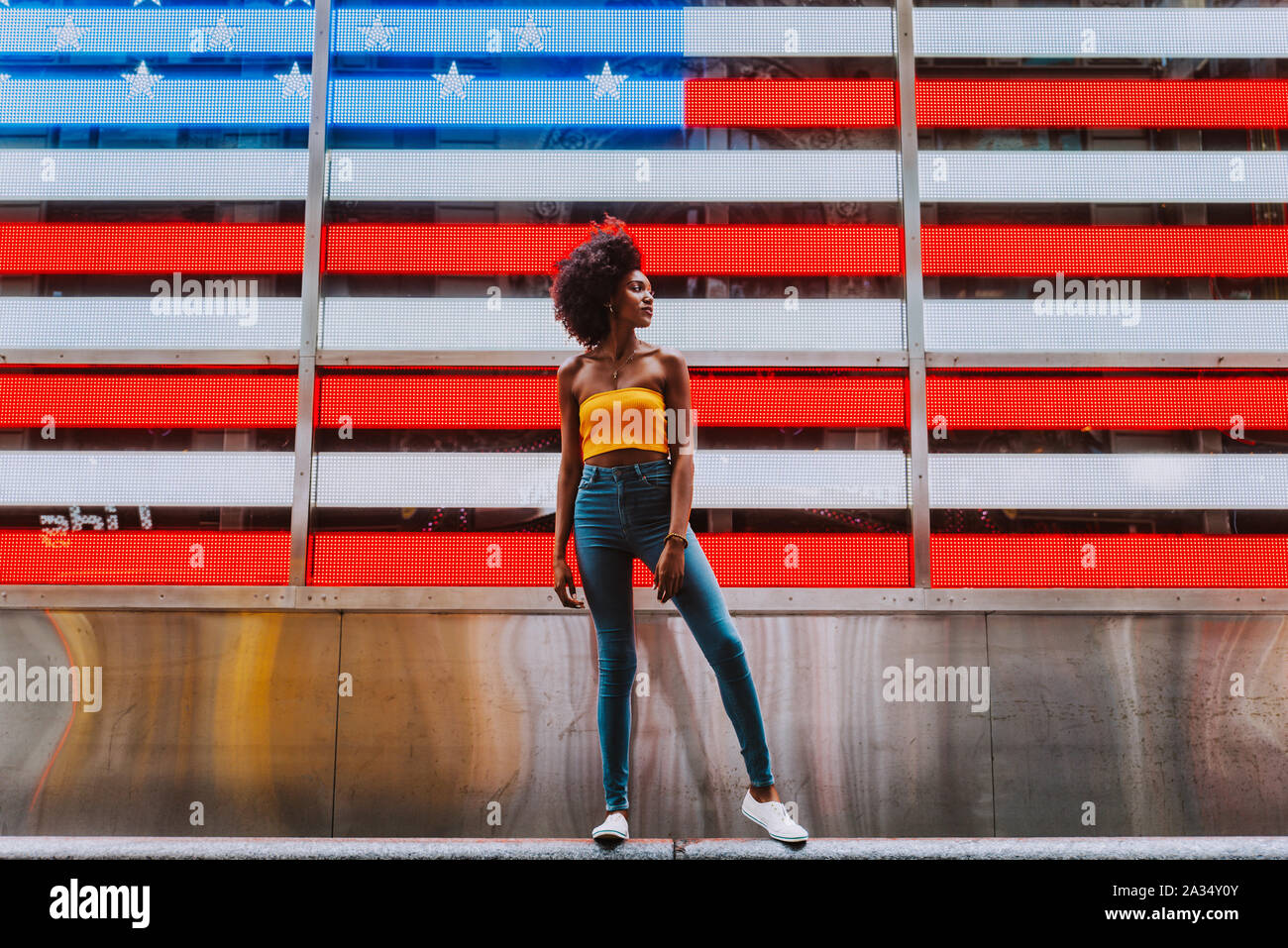 Young beautiful girl walking in Time square, manhattan. Lifestyle ...